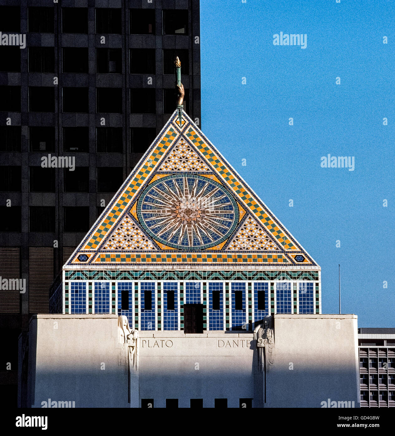 A mosaic of multicolored ceramic tiles decorates the pyramid roof atop ...