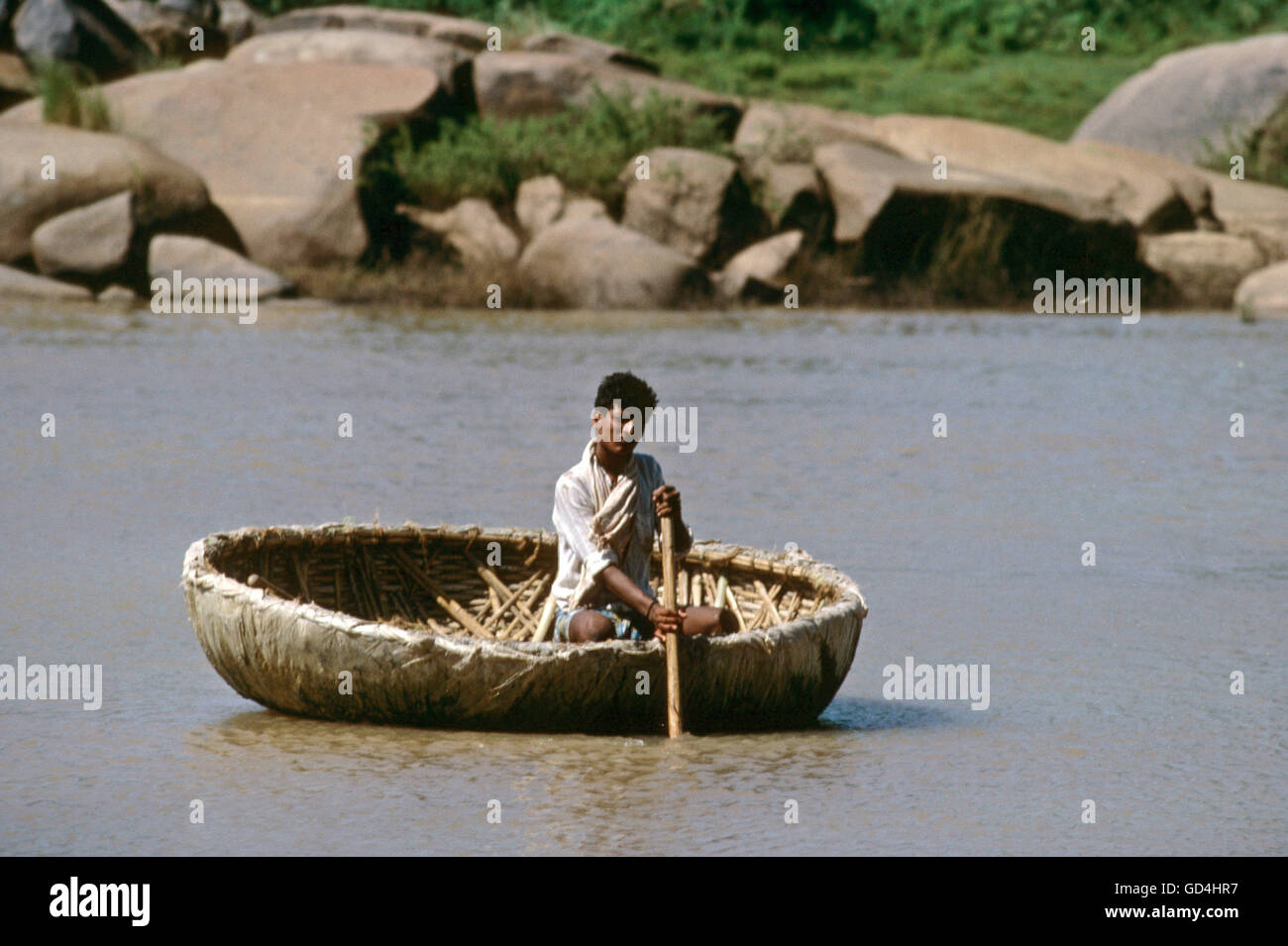 Villager in a coracle Stock Photo - Alamy