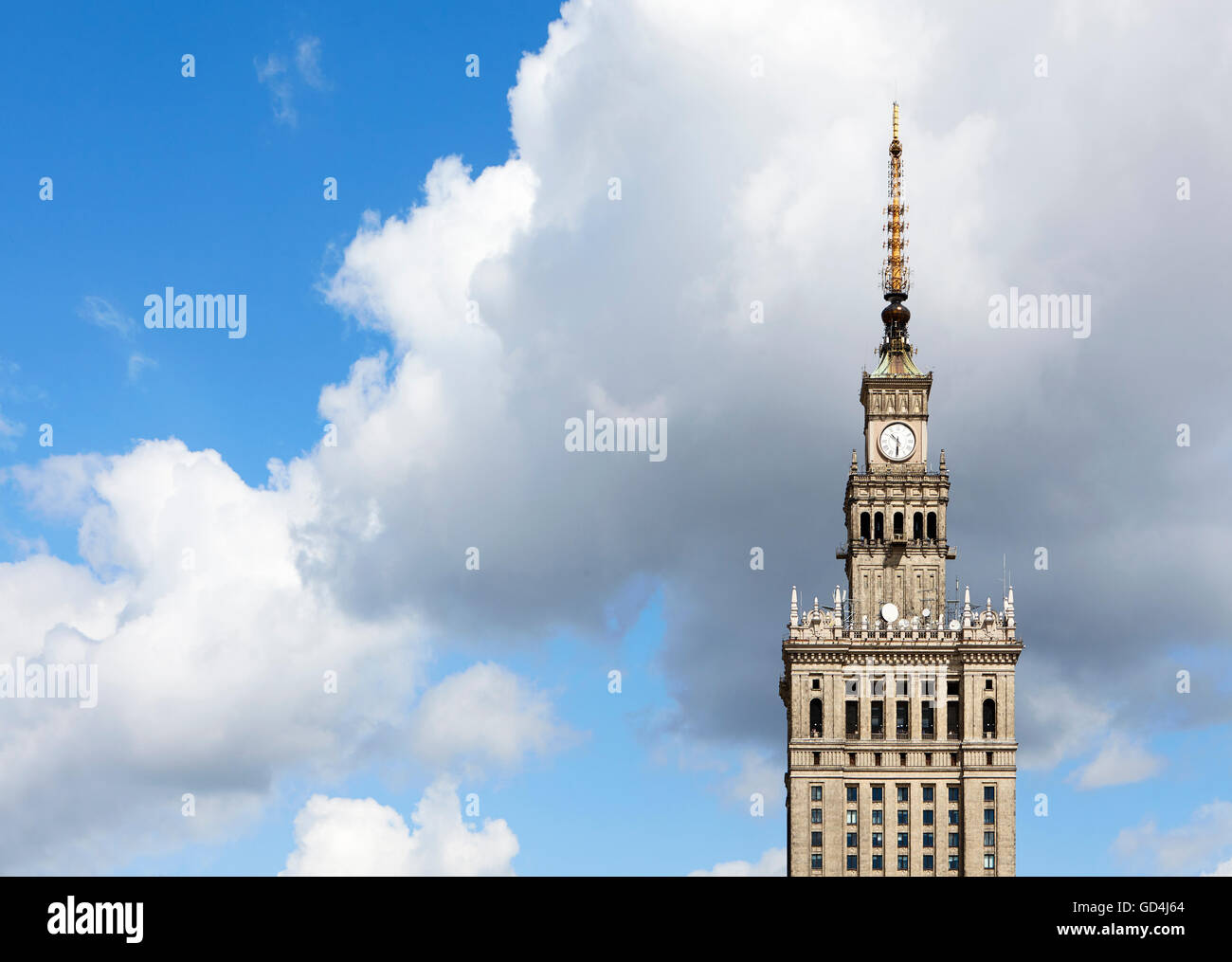 The top of old skyscraper against the cloudy sky. Warsaw symbol Stock ...