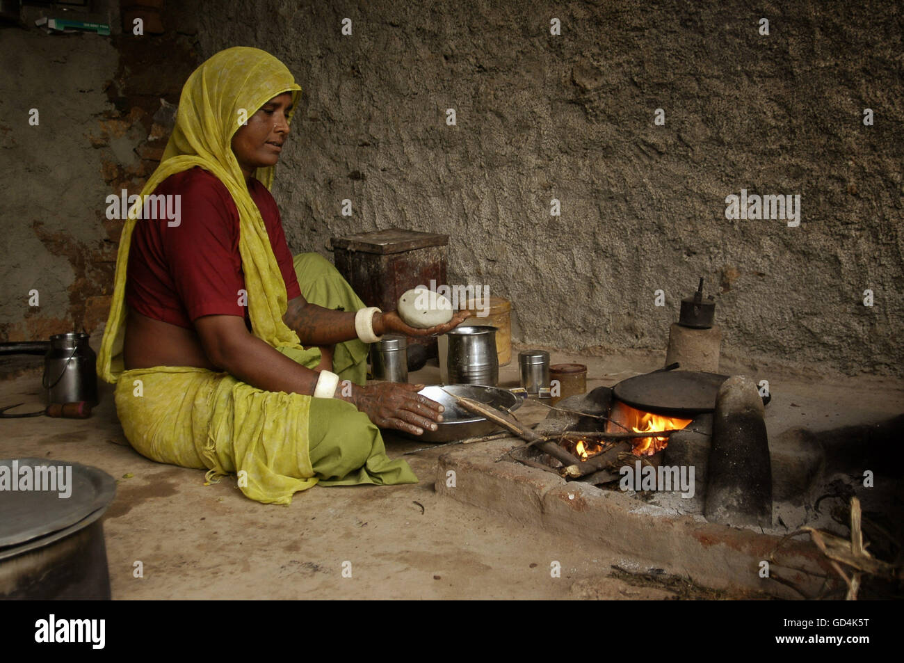 Woman cooking food Stock Photo - Alamy