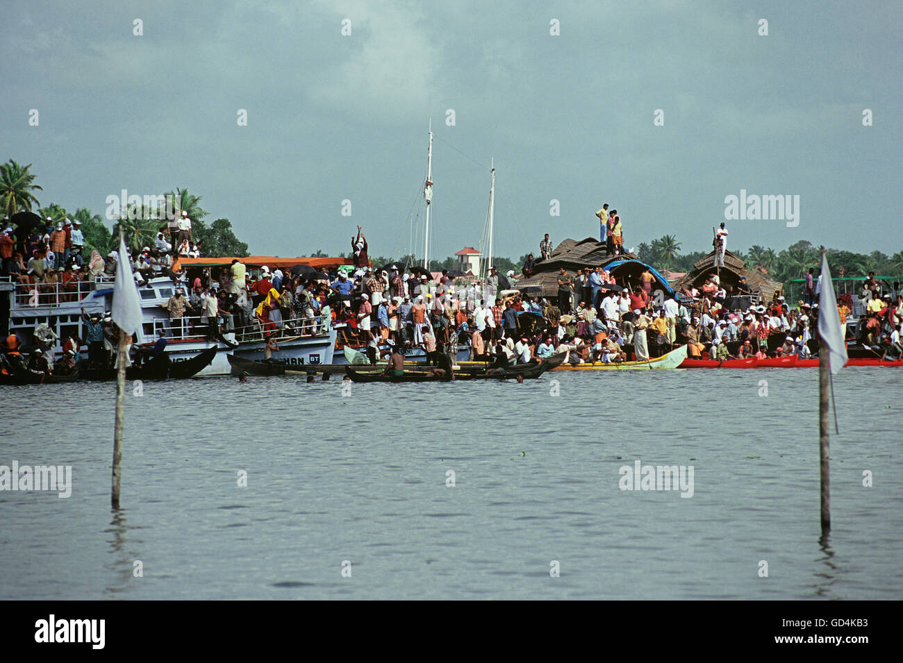 Spectators watching boat race Stock Photo - Alamy