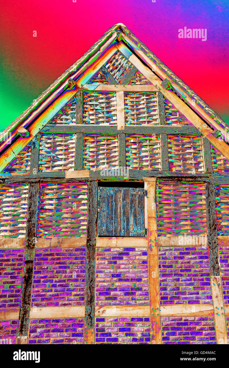 A fantastic old barn with upper walls woven from split timber on a farm ...