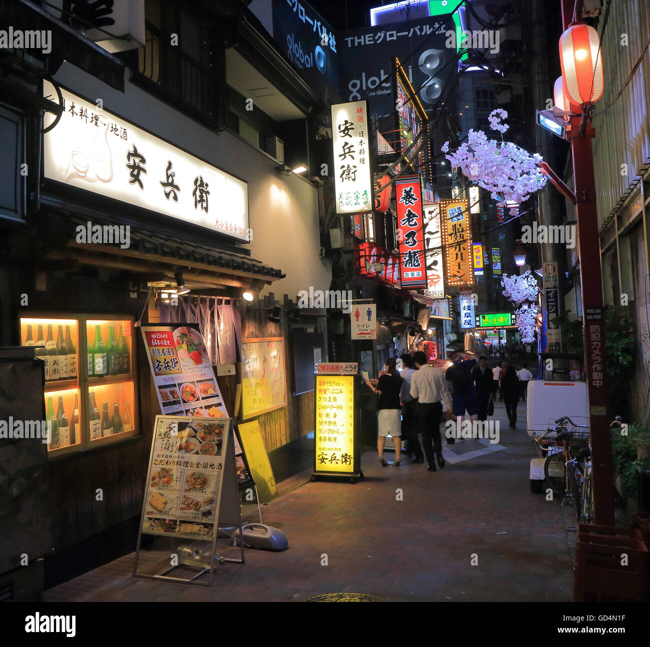 People visit Omoide Yokocho bar street in Shinjuku Tokyo Japan ...