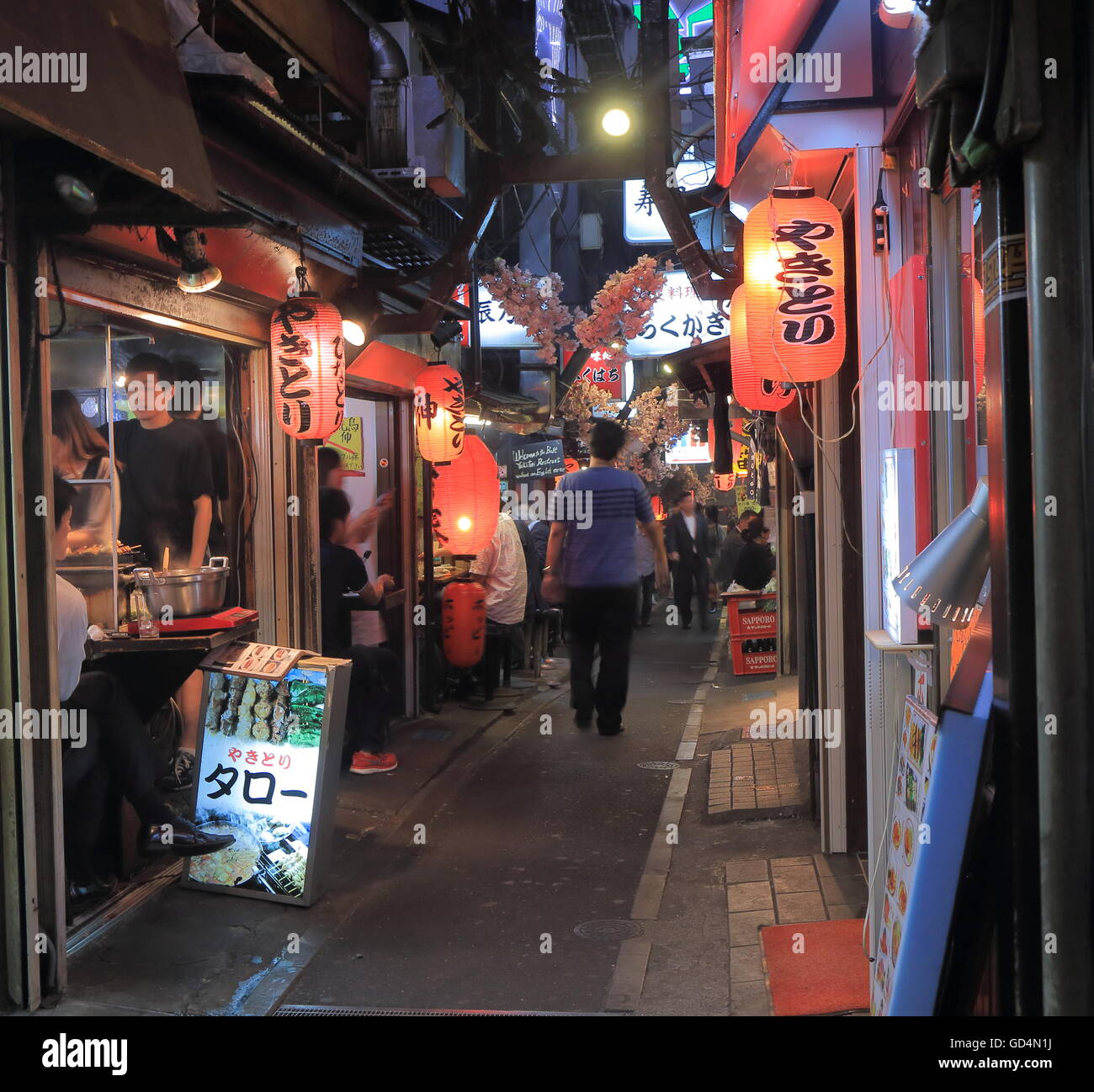 People visit Omoide Yokocho bar street in Shinjuku Tokyo Japan ...