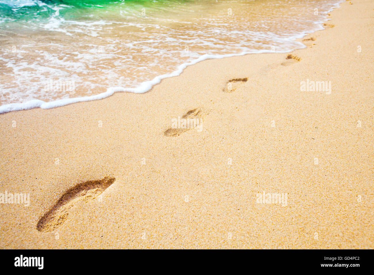 beach, wave and footprints Stock Photo - Alamy