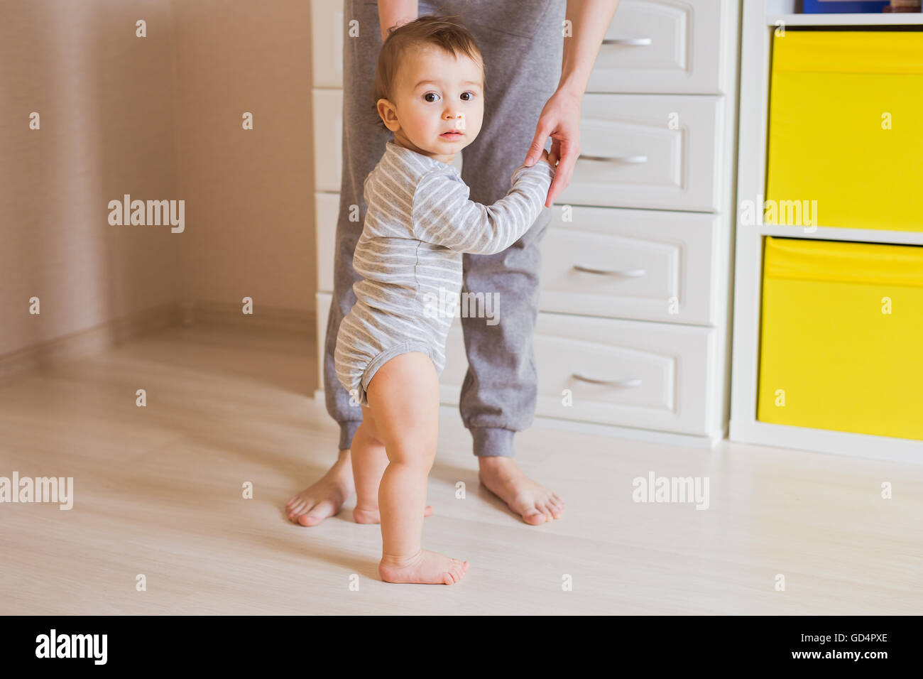 First steps of cute baby boy Stock Photo - Alamy