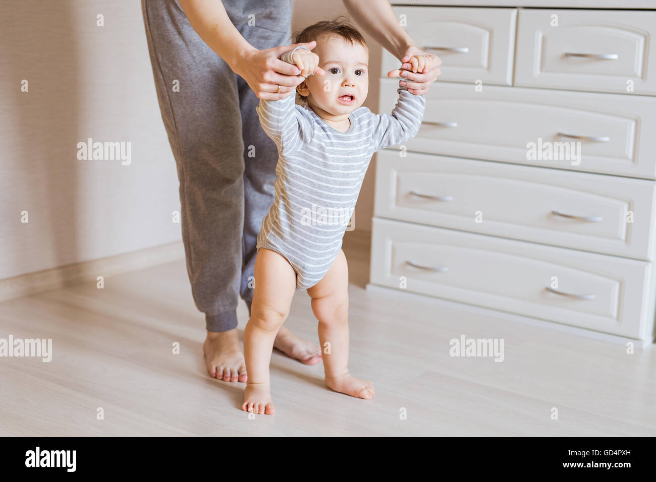First steps of cute baby boy Stock Photo - Alamy