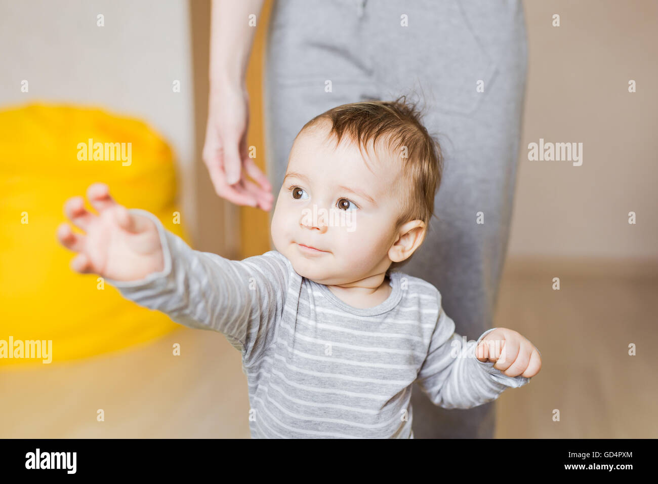 First steps of cute baby boy Stock Photo - Alamy