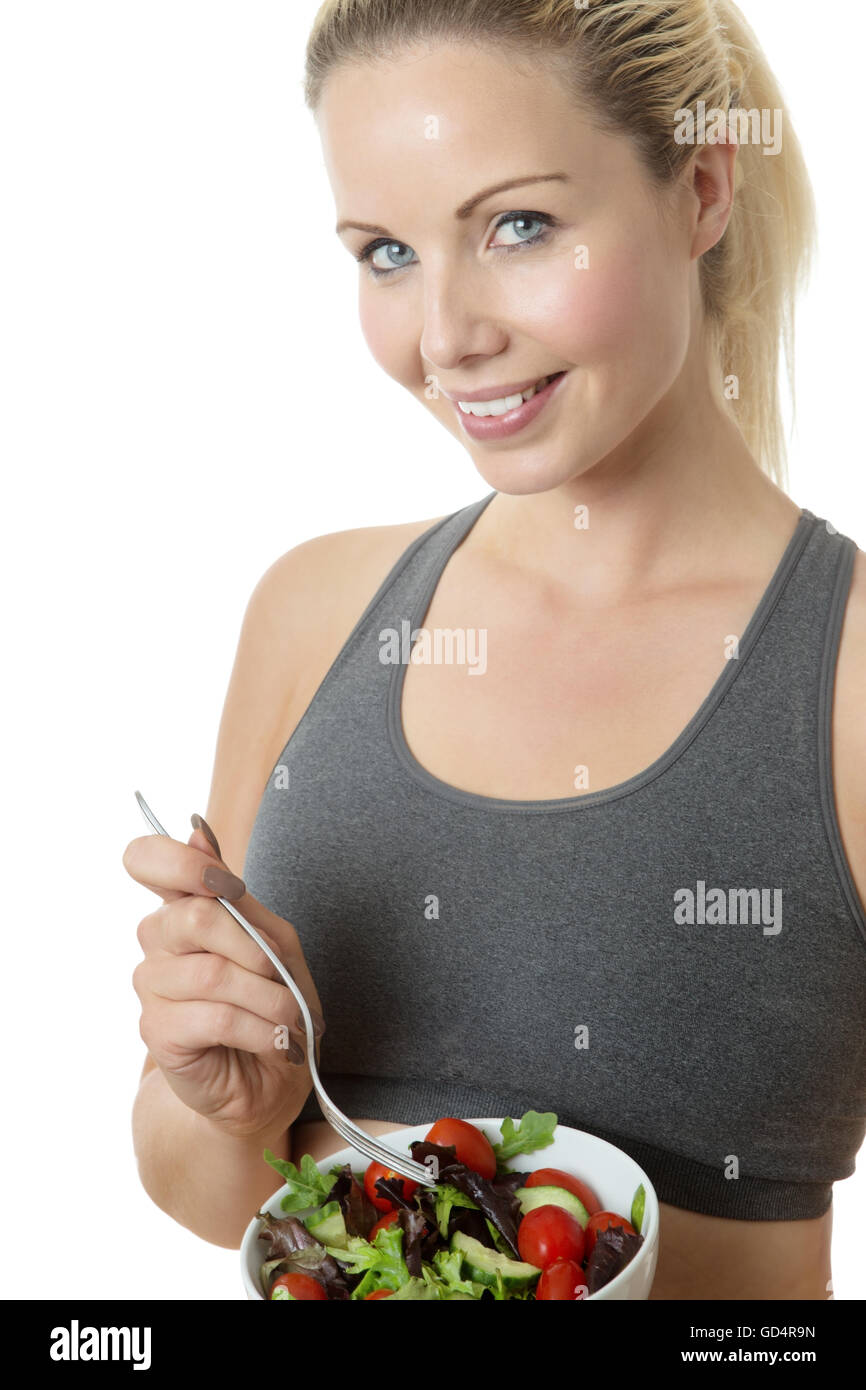 happy fitness woman eating salad with a great smile Stock Photo - Alamy