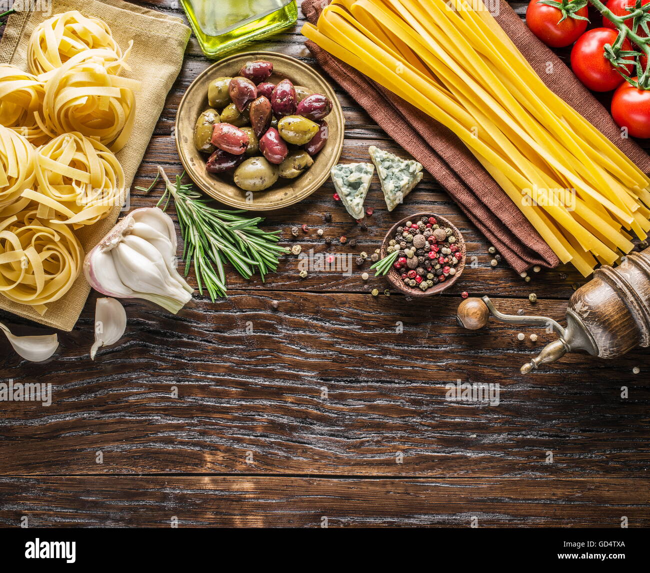 Pasta ingredients. Cherry-tomatoes, spaghetti pasta, rosemary and ...