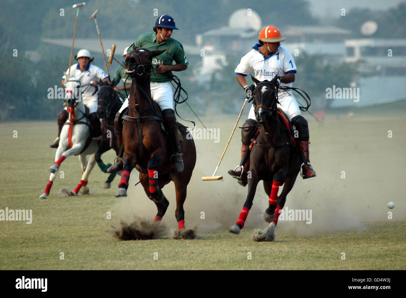 Polo players in action Stock Photo - Alamy