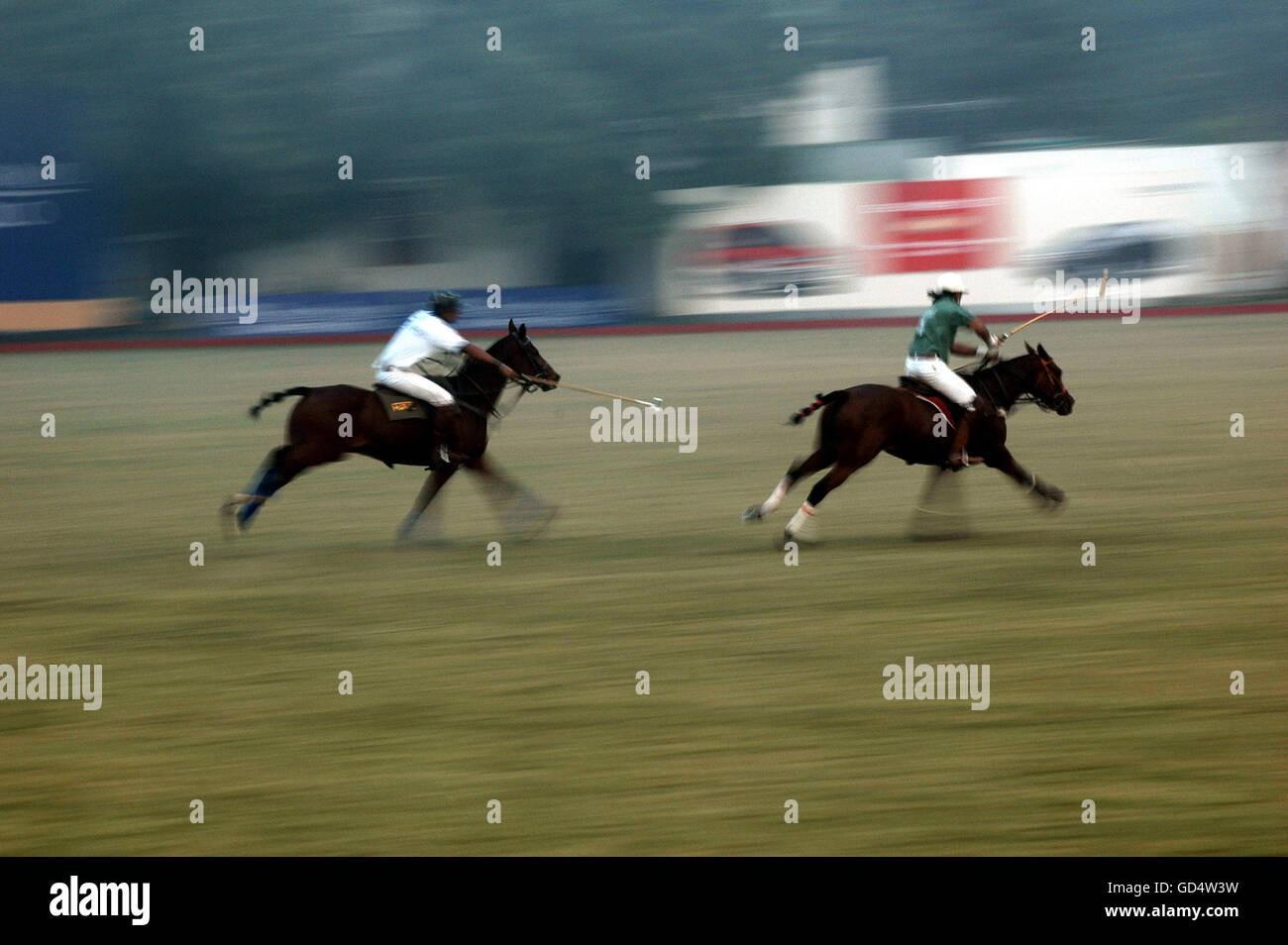 Polo players in action Stock Photo - Alamy