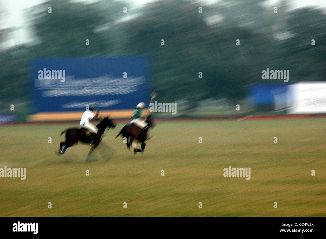 Polo players in action Stock Photo - Alamy