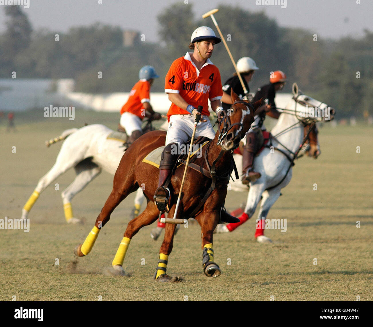 Polo players in action Stock Photo - Alamy