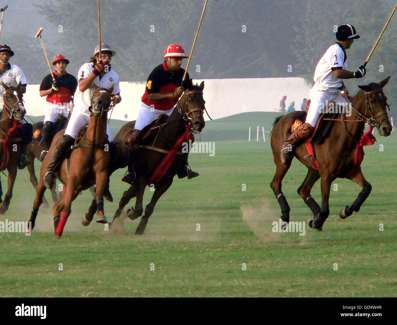 Polo players in action Stock Photo - Alamy