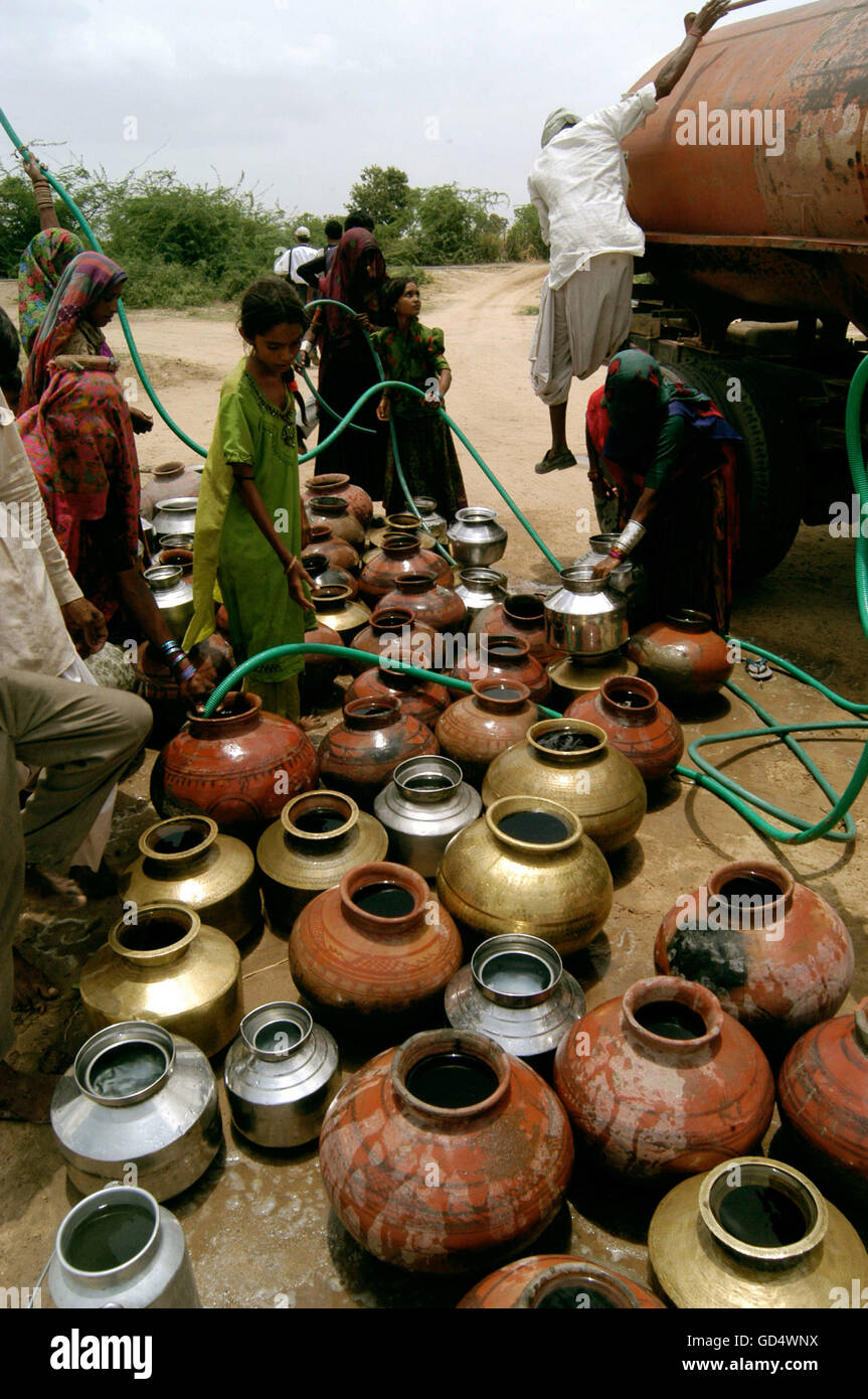 People filling water in pots Stock Photo - Alamy