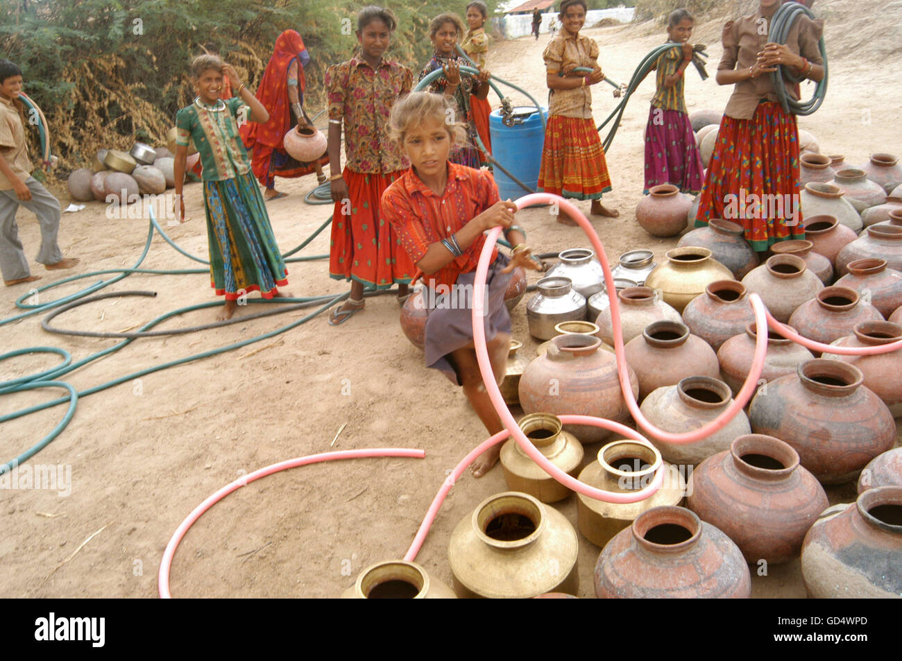 Villagers collecting drinking water Stock Photo - Alamy