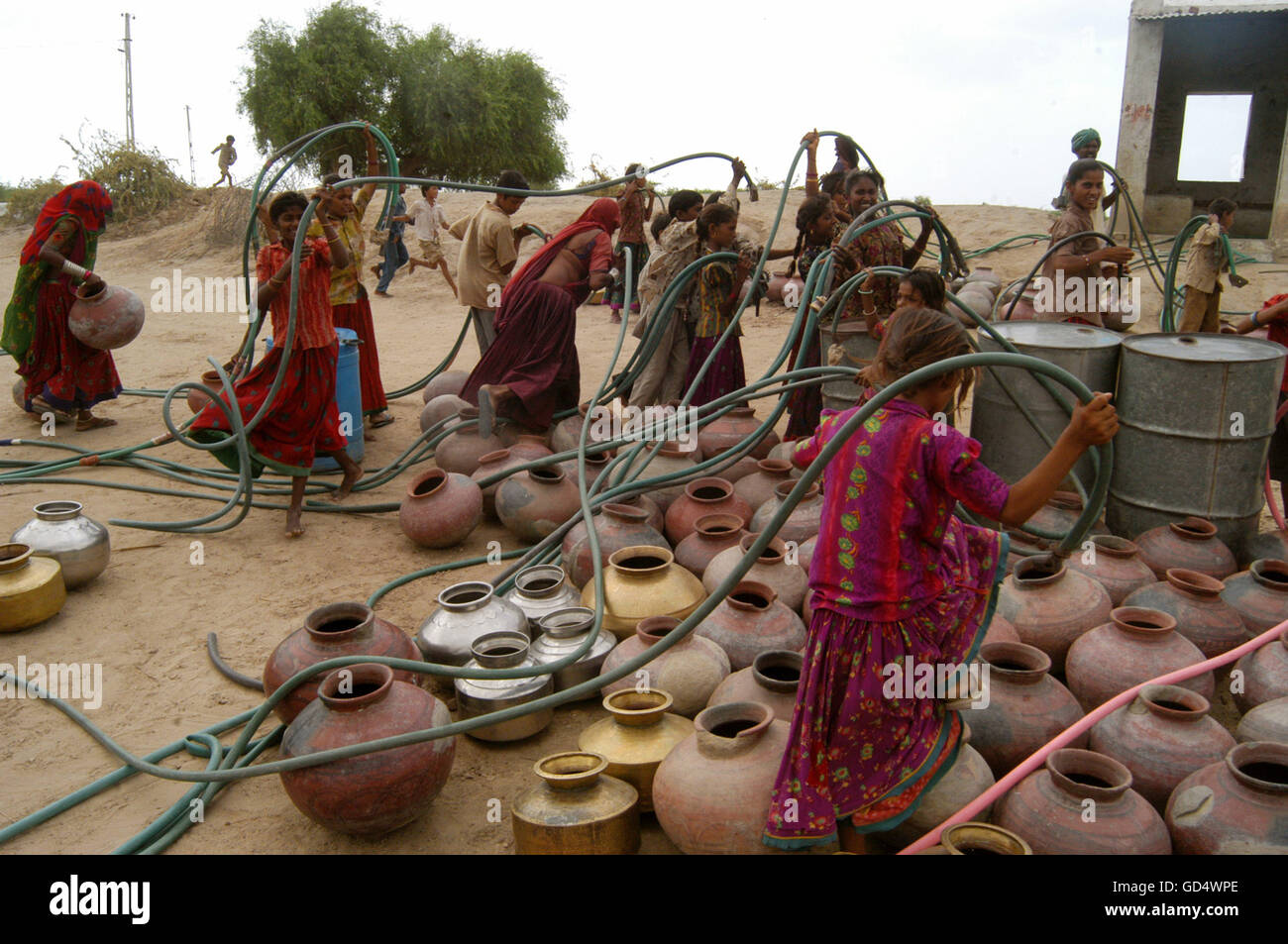 Villagers collecting drinking water Stock Photo - Alamy