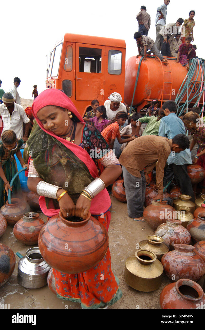 Villagers collecting water from a tanker Stock Photo - Alamy