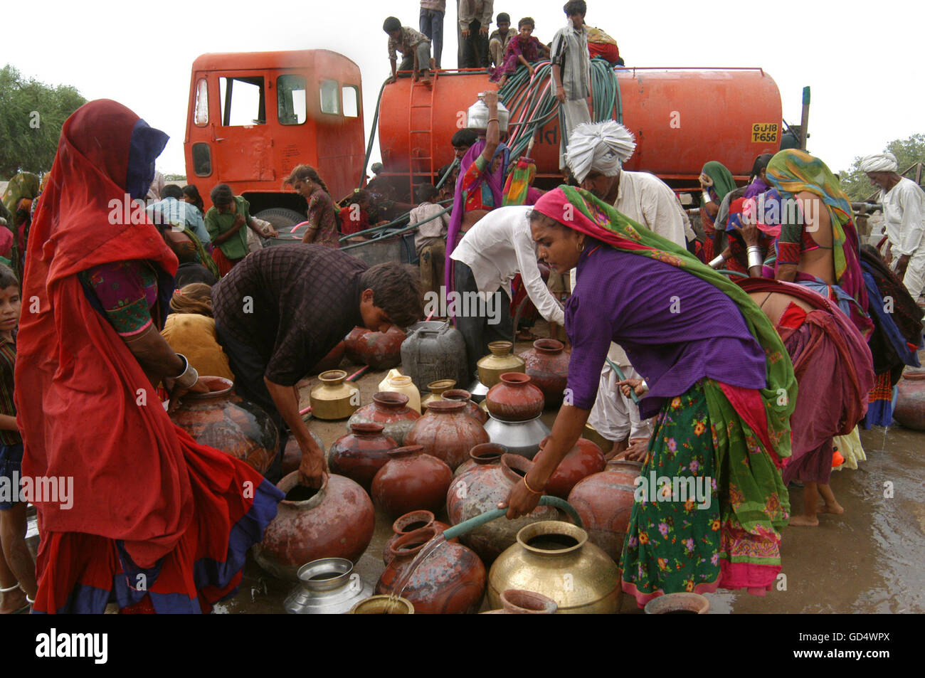 Villagers collecting water from a tanker Stock Photo - Alamy