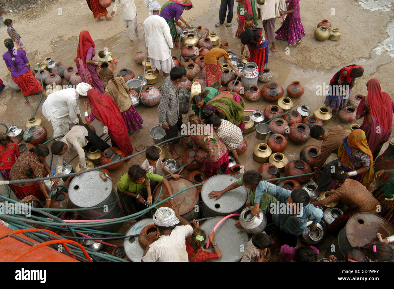 Villagers collecting water from a tanker Stock Photo - Alamy