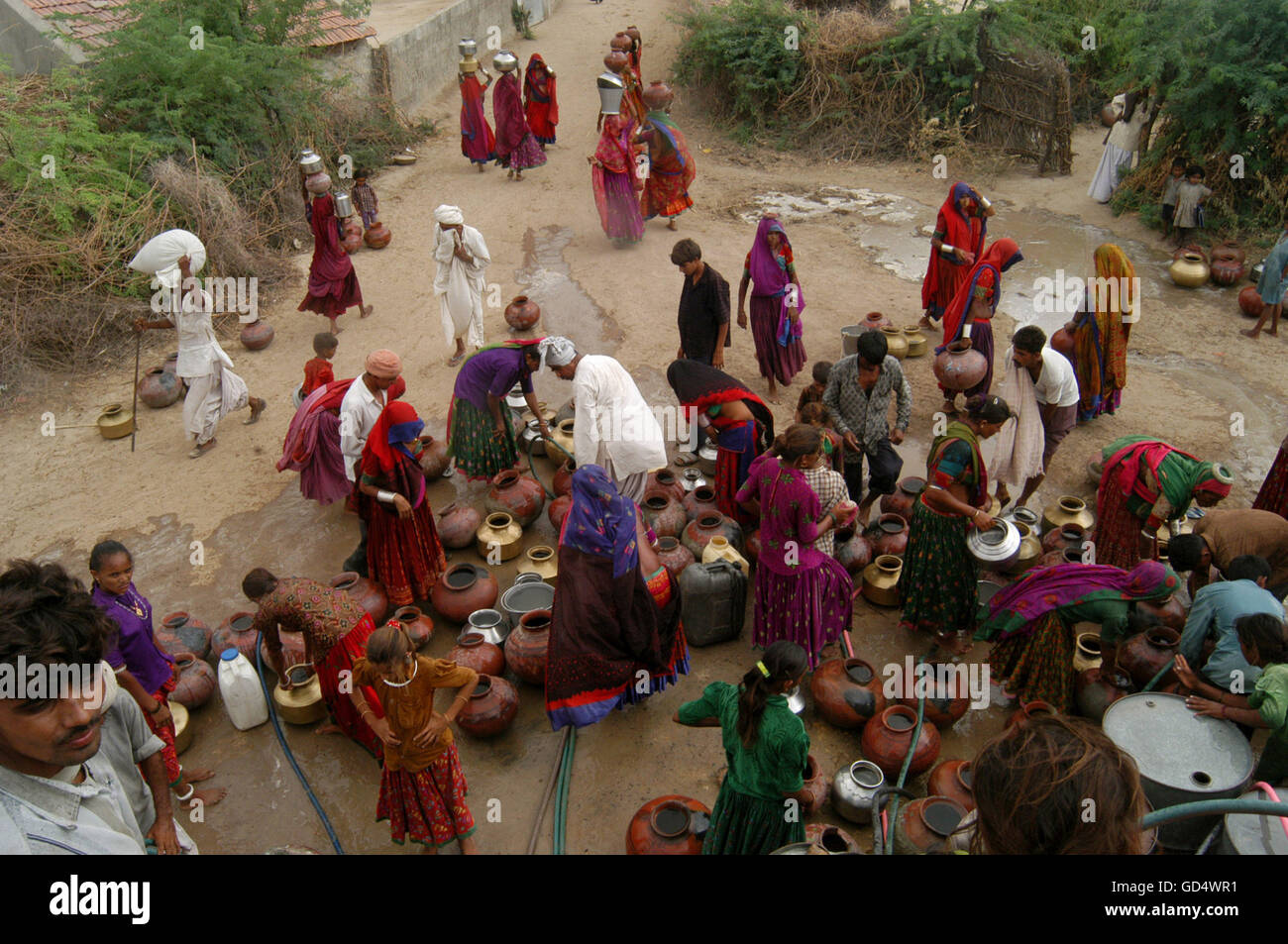 Villagers collecting water from a tanker Stock Photo - Alamy