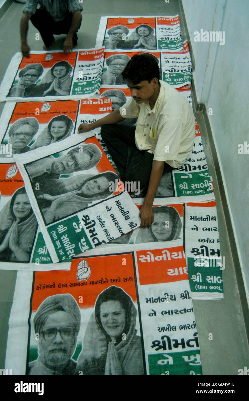 Worker preparing posters Stock Photo - Alamy