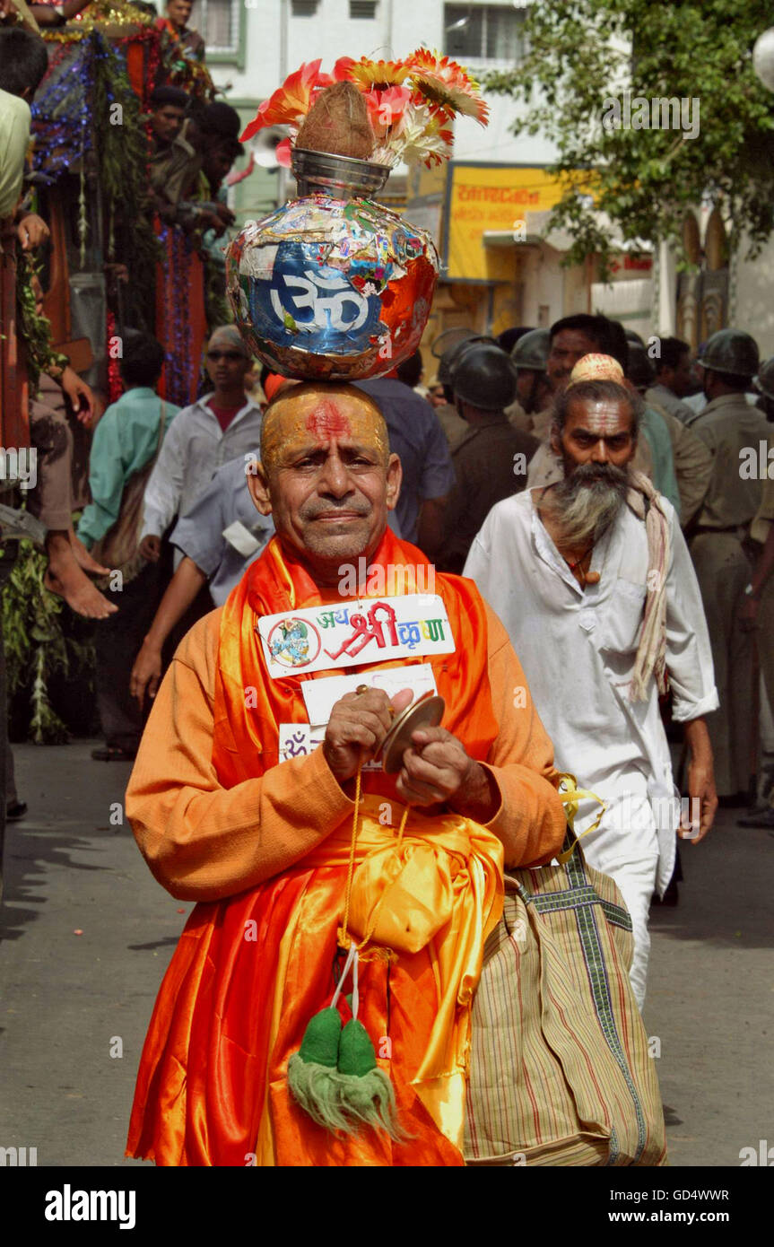 Sadhu walking down a street Stock Photo - Alamy