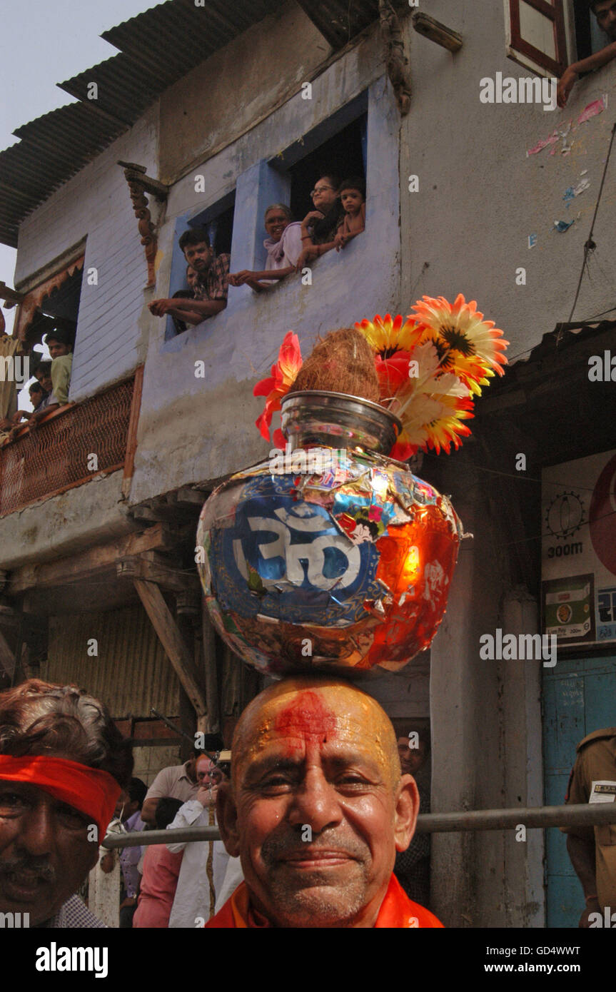 A man walking with a pot Stock Photo - Alamy