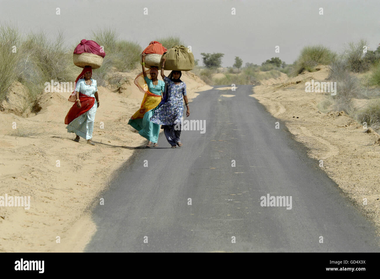 Women carrying baskets Stock Photo - Alamy