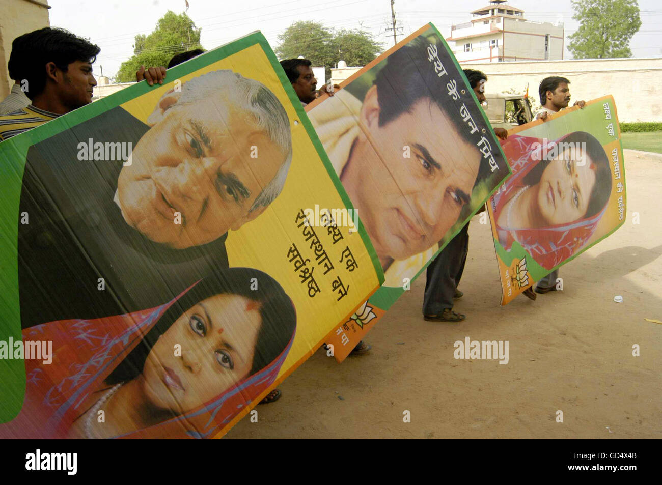 Workers carrying posters Stock Photo - Alamy