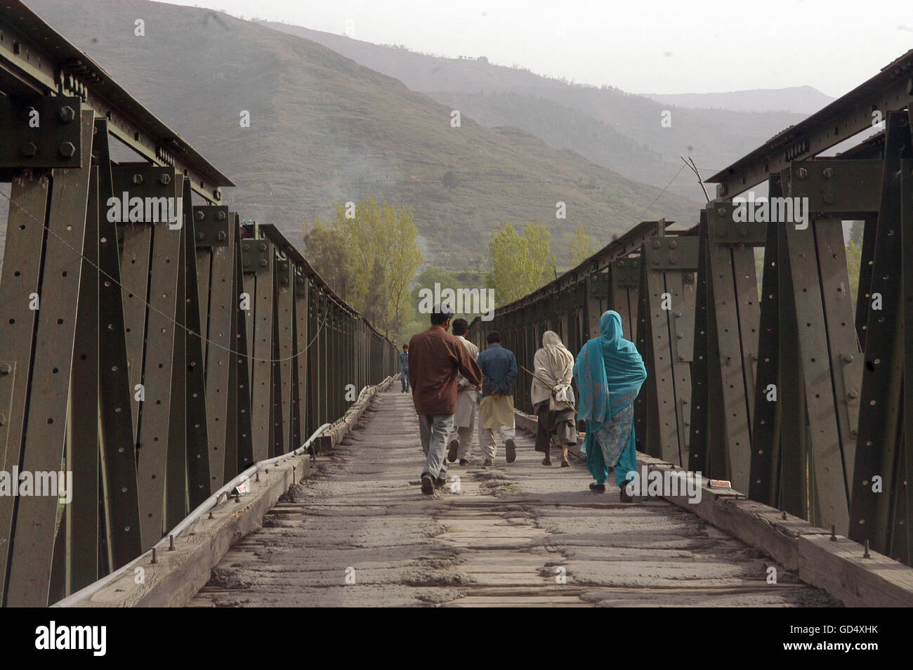 People crossing the wooden bridge Stock Photo - Alamy