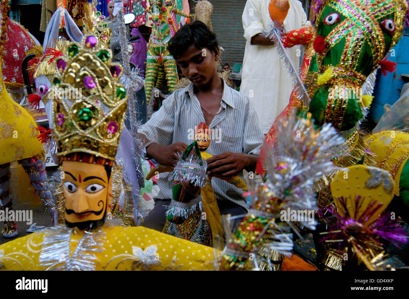 Puppeteer giving last touches to his puppet Stock Photo - Alamy