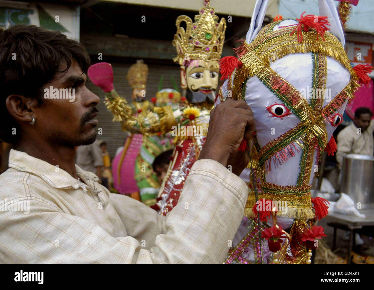 Puppeteer giving last touches to his puppet Stock Photo - Alamy