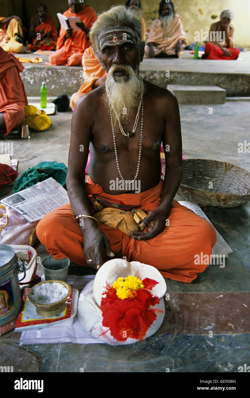Sadhu With Flower Offering At Temple Stock Photo - Alamy