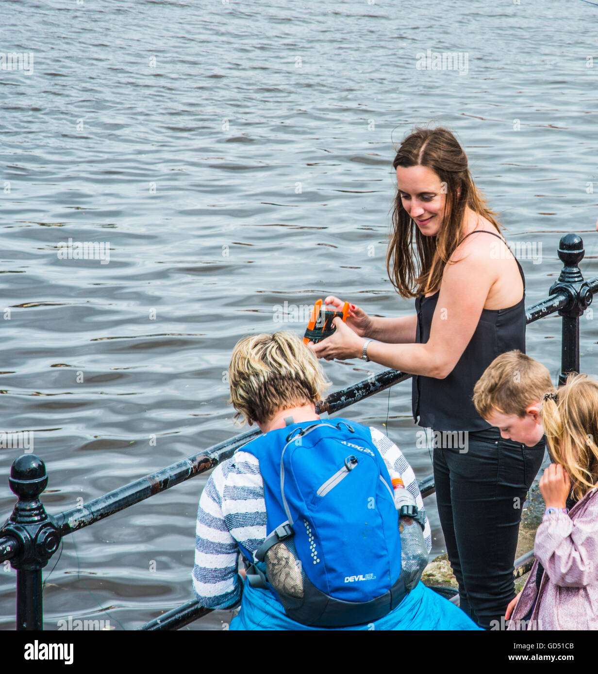 Smiling faces whilst fishing for crabs in Whitby Yorkshire Ray Boswell ...