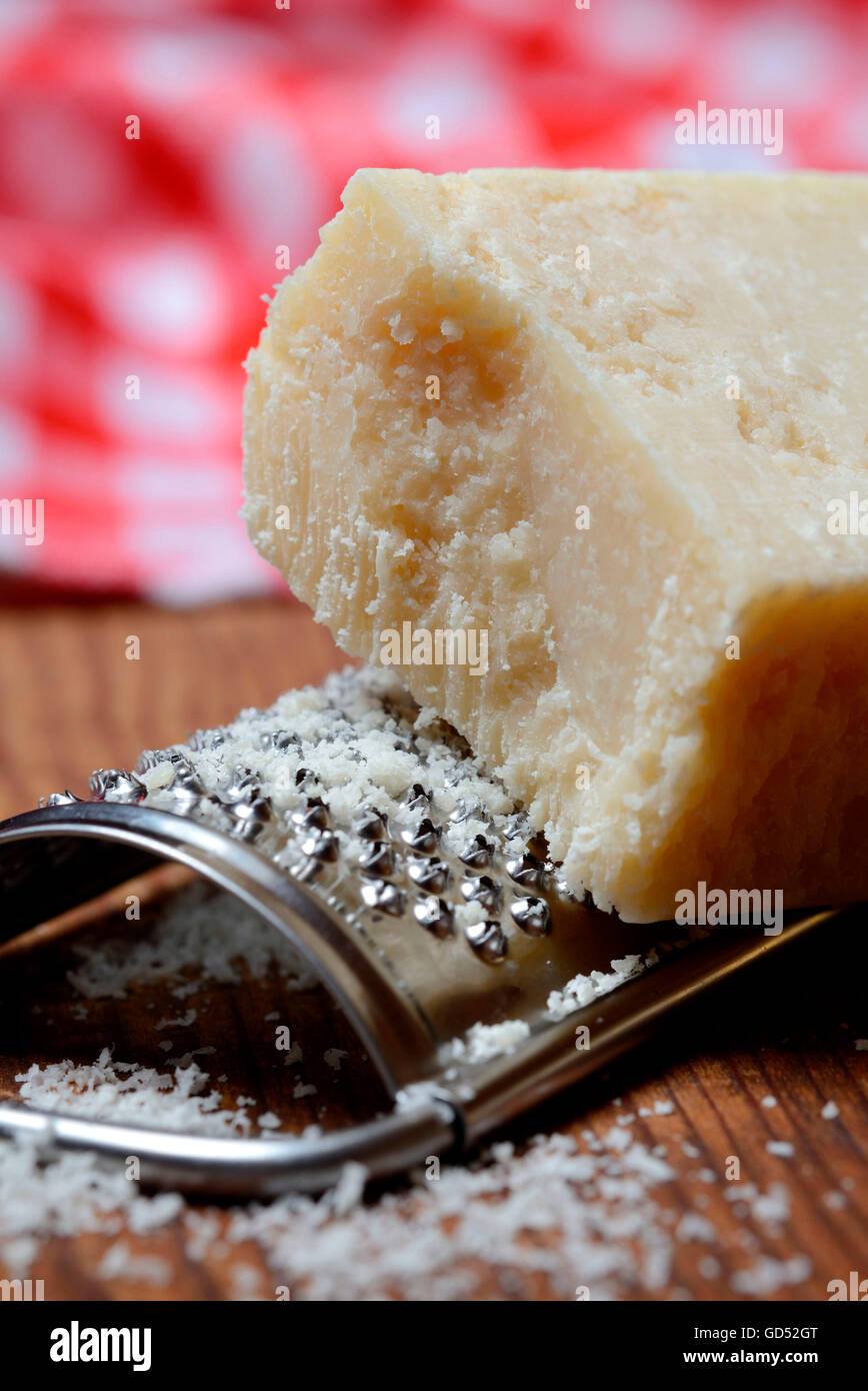 Parmesan cheese, parmesan grater Stock Photo - Alamy