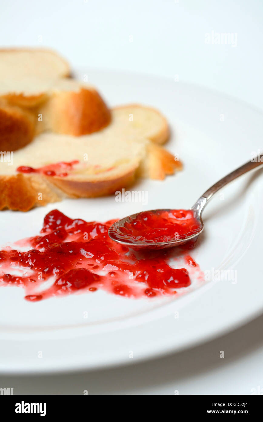 Jam on plate, slice of bread Stock Photo - Alamy