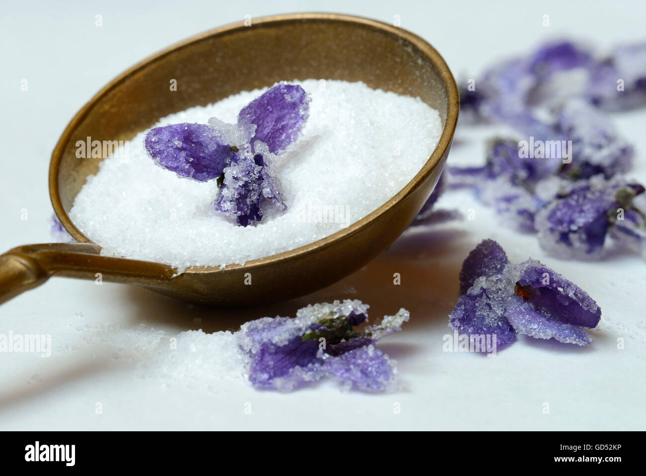 Candied violet blossoms, on sugar Stock Photo - Alamy