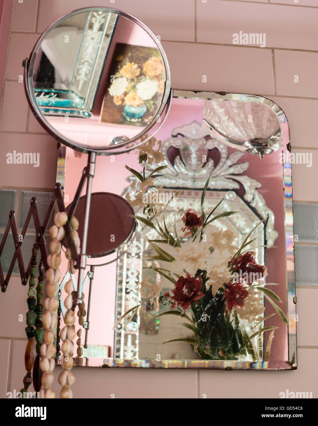 Detail of vanity mirror with painted vintage mirror in the background ...