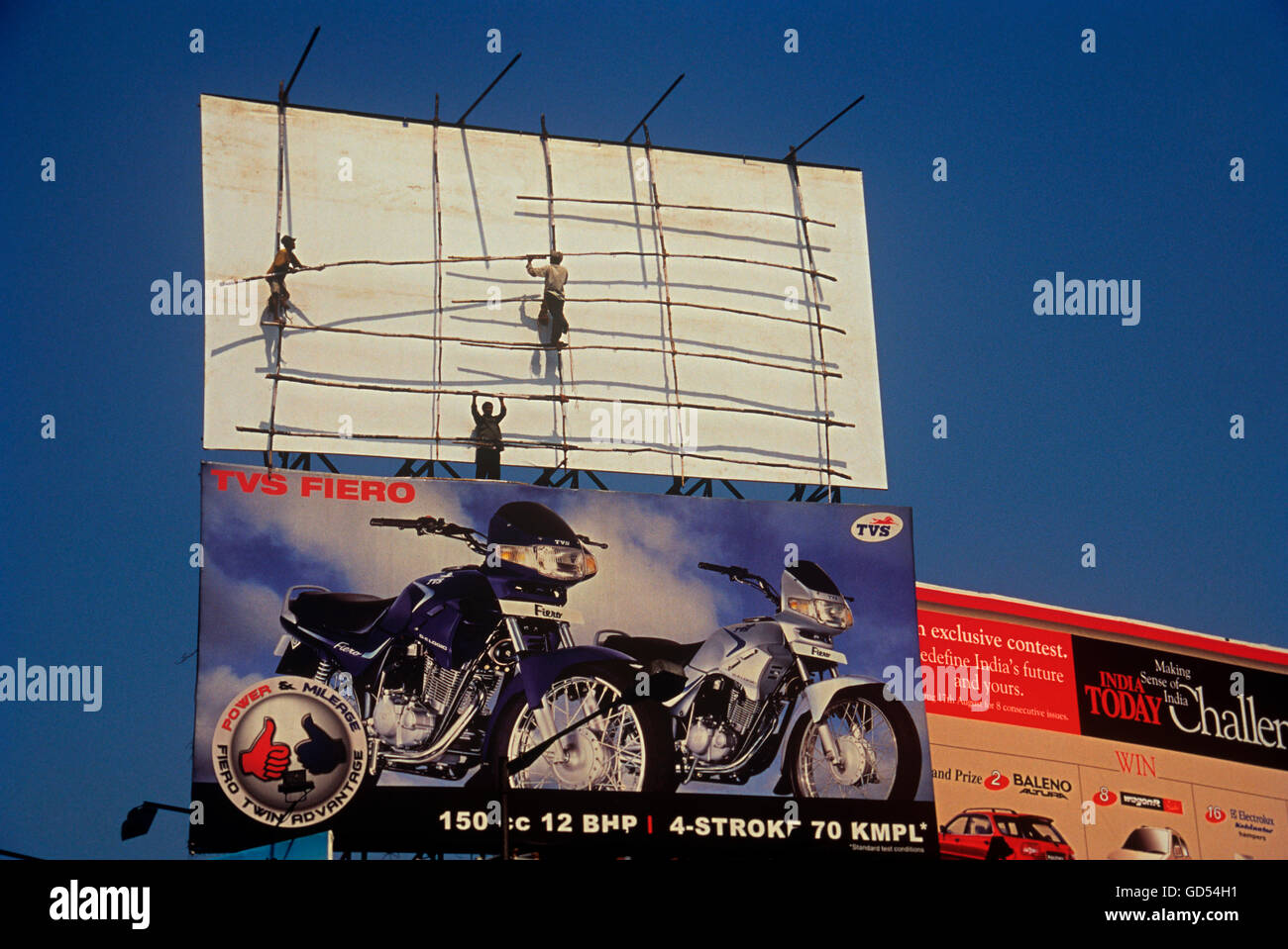 Men working on a billboard Stock Photo - Alamy