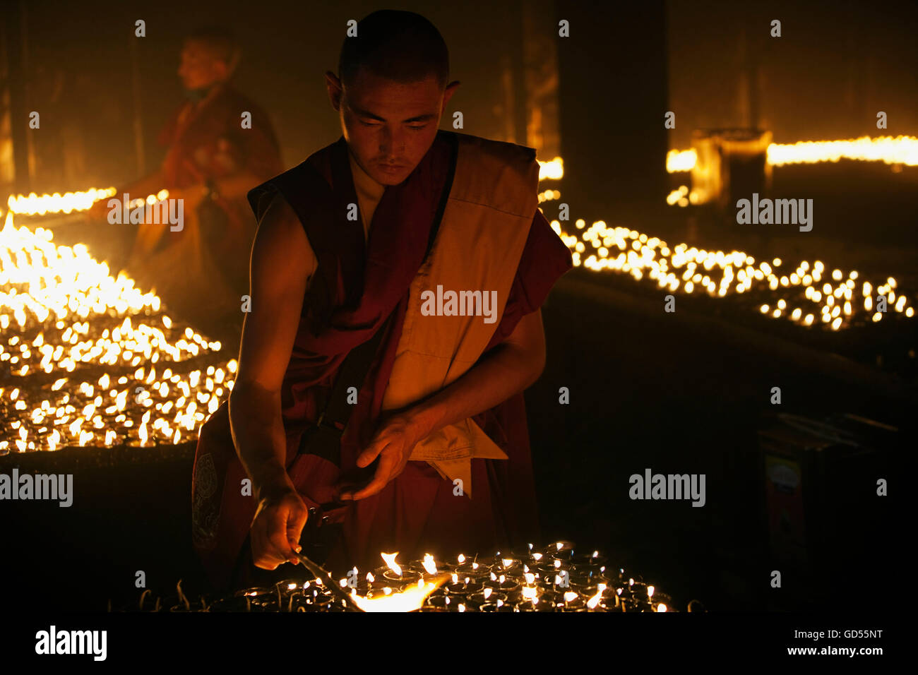Buddhist monk lighting Diyas Stock Photo - Alamy