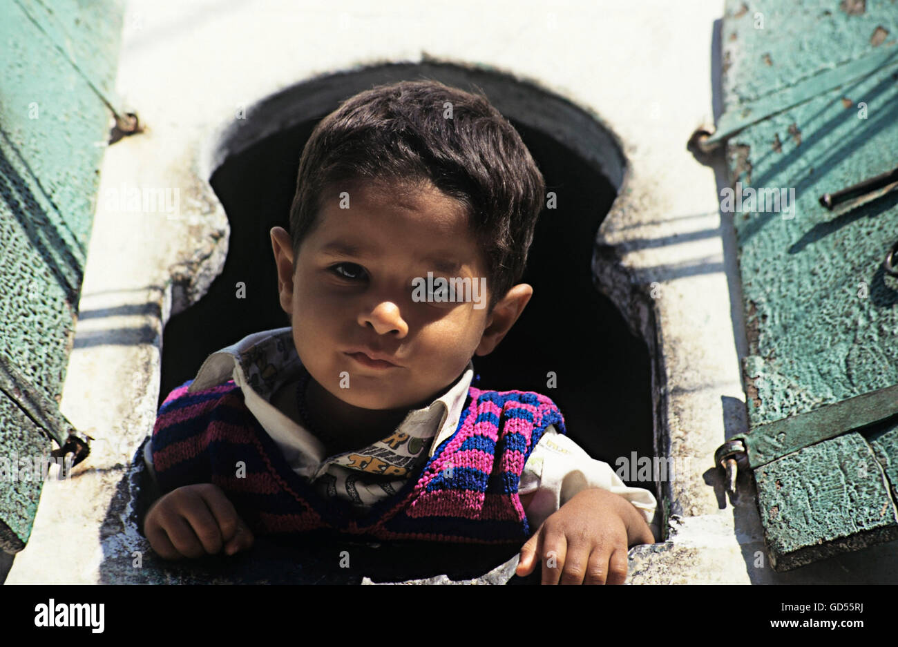 Young boy at a window Stock Photo - Alamy