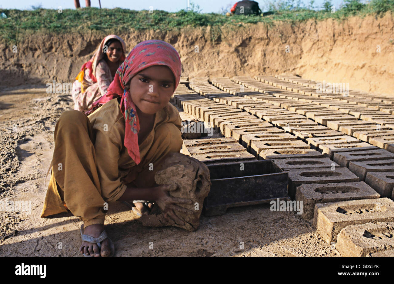 Village children making clay bricks Stock Photo - Alamy