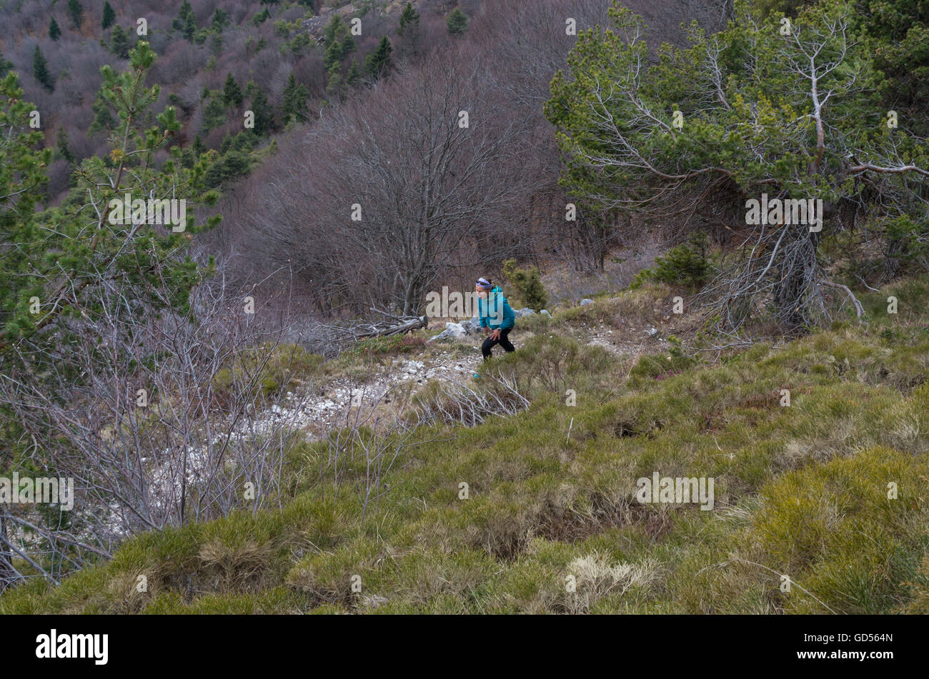 Female running in mountains at Lake Garda, Italy Stock Photo - Alamy