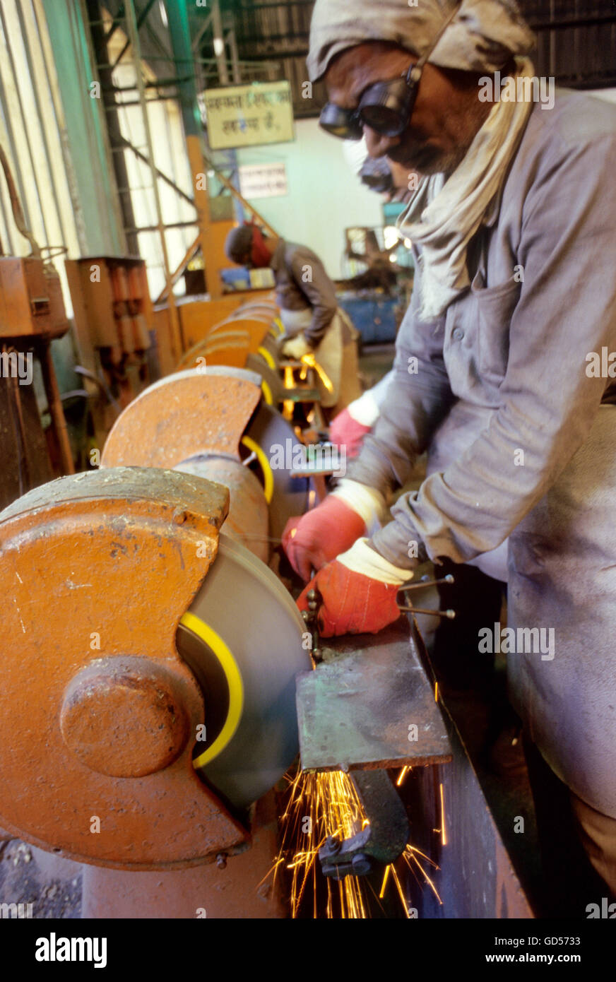 Workers at a factory Stock Photo - Alamy