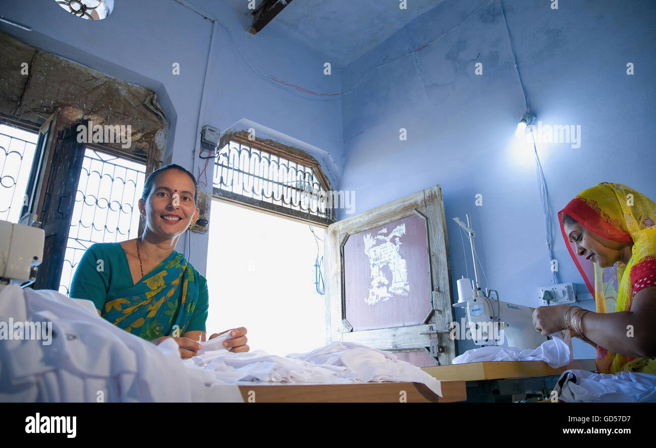 Women stitching clothes Stock Photo - Alamy