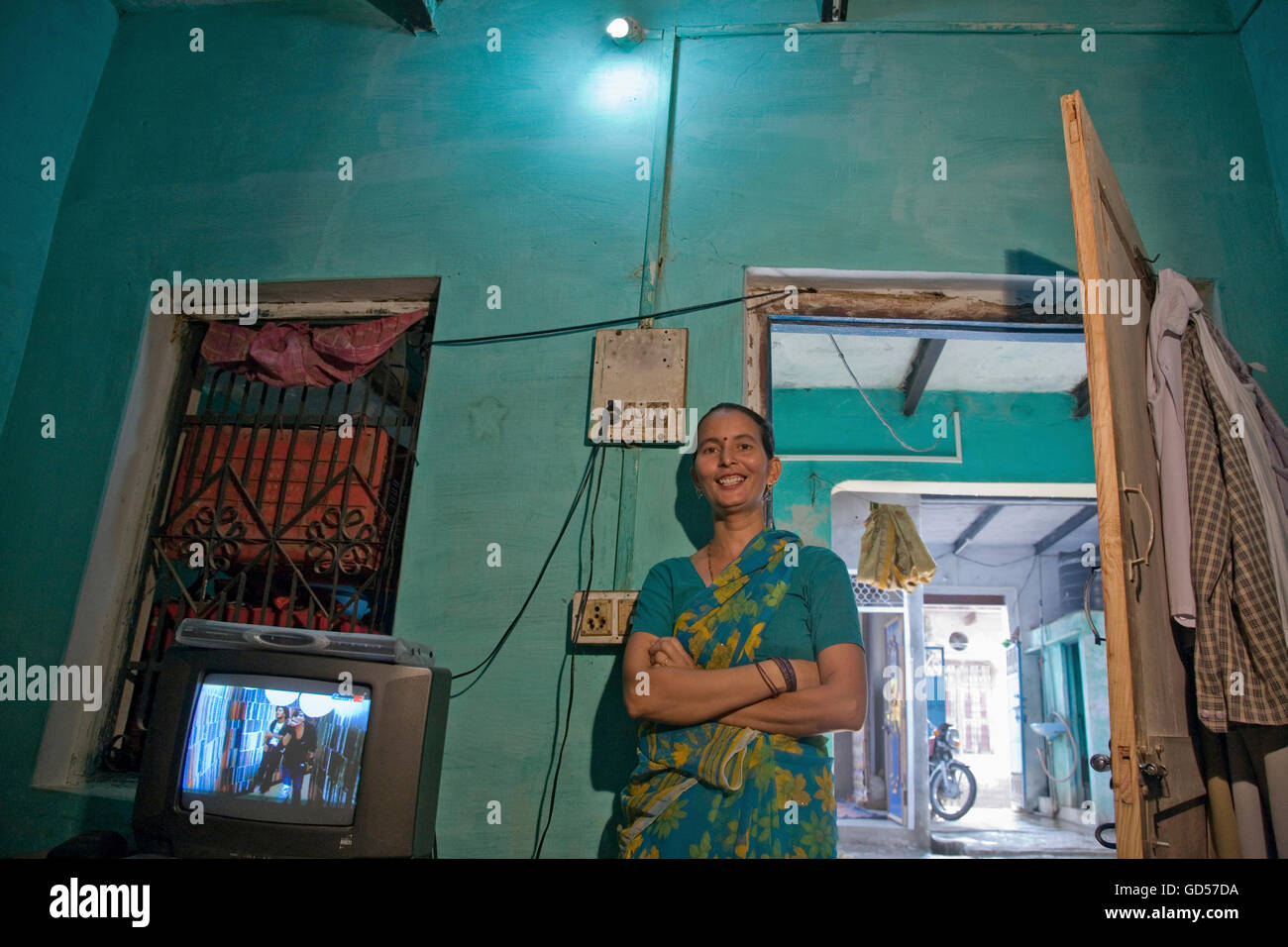 Woman standing inside a room Stock Photo - Alamy