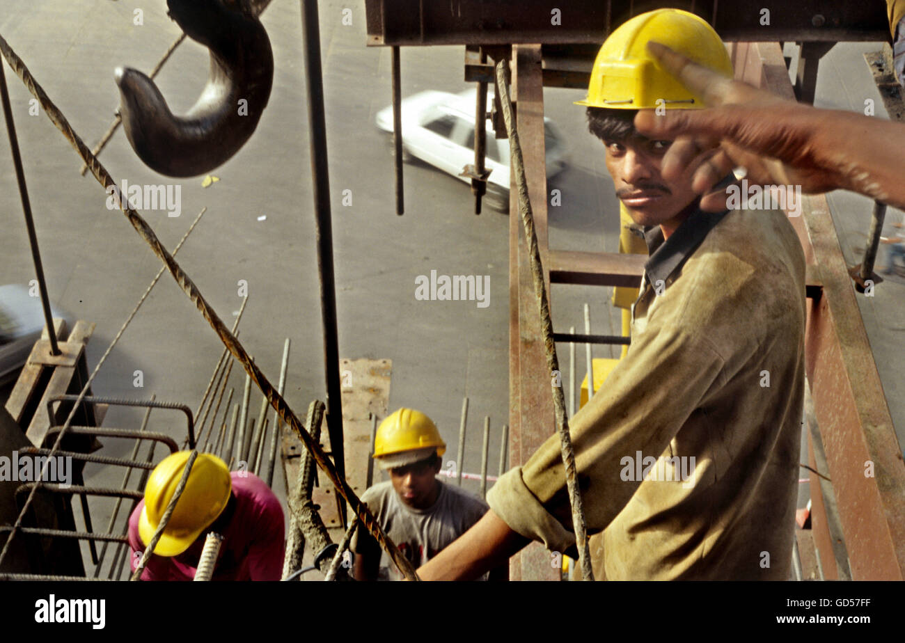 Men working at the construction site Stock Photo - Alamy