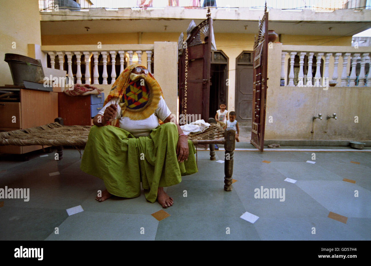 A woman fanning herself Stock Photo - Alamy